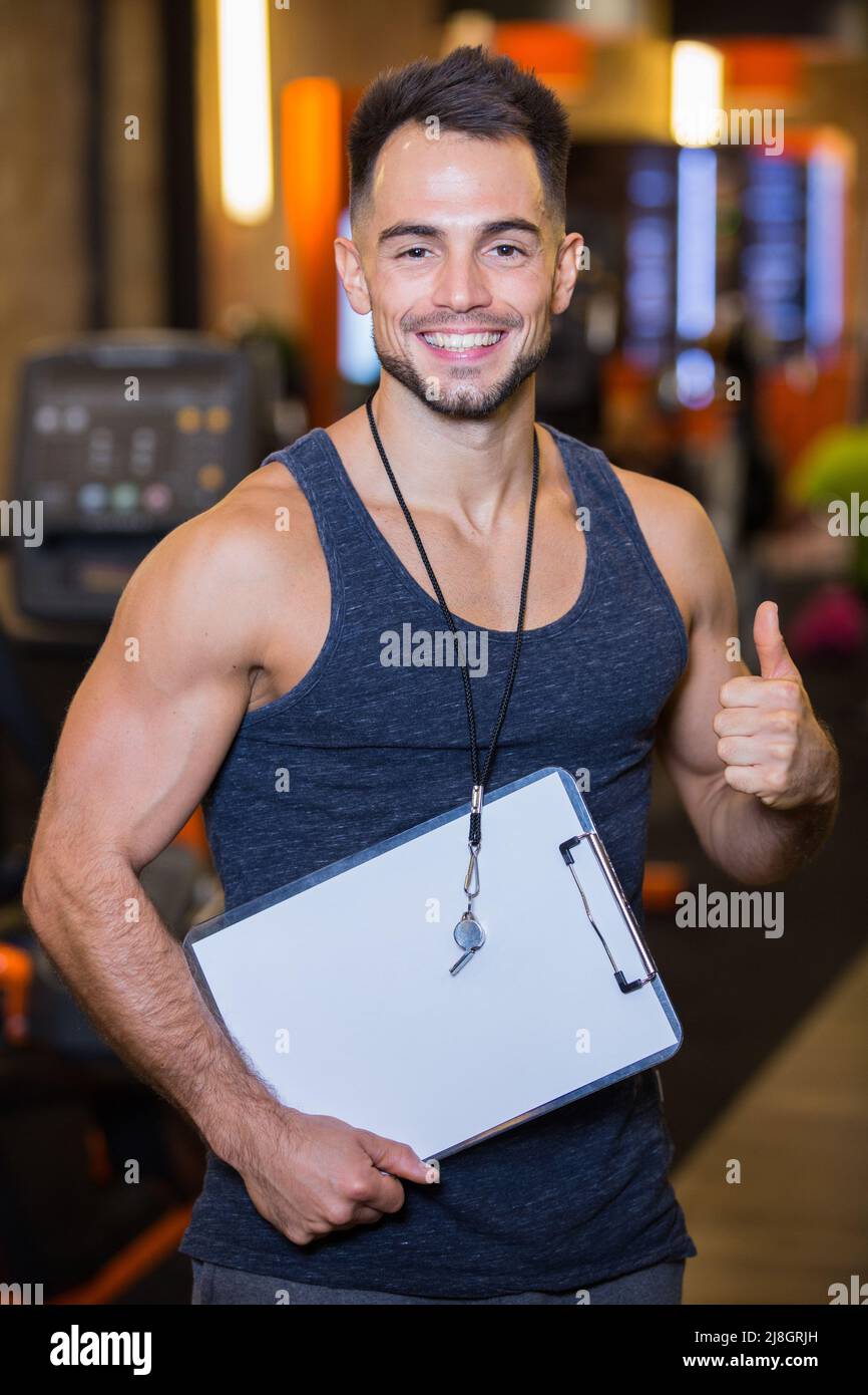 Smiling personal trainer hi-res stock photography and images - Alamy