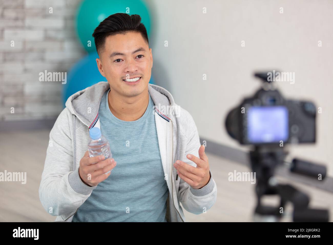 man recording a blog or streaming yoga workout Stock Photo - Alamy