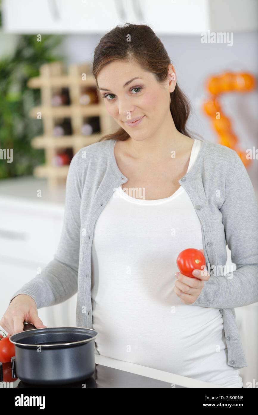 professional pregnant cook sauce for pizza Stock Photo - Alamy