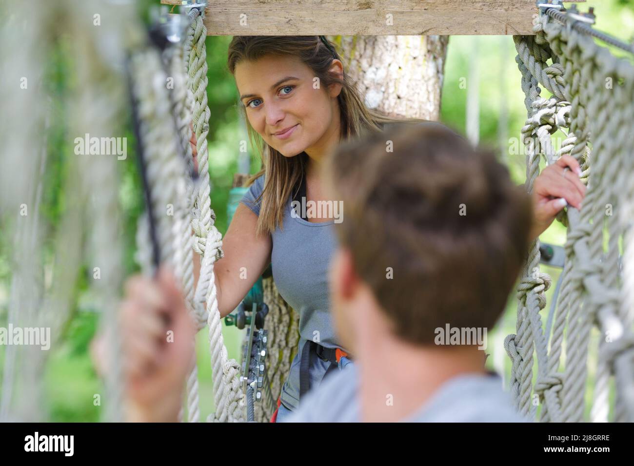 portrait of a couple and a rope bridge Stock Photo - Alamy