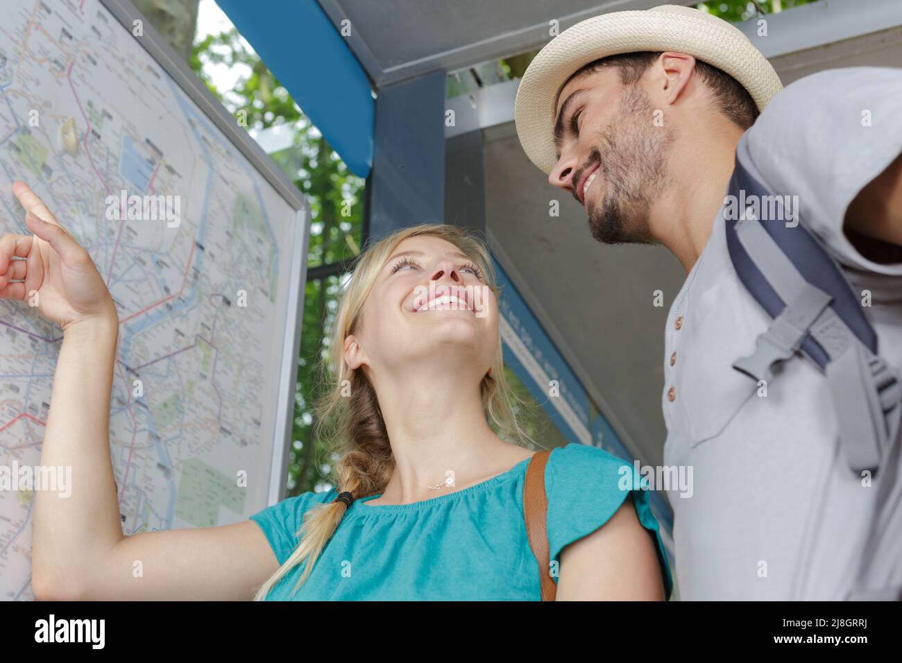 girlfriend pointing at public transport map Stock Photo - Alamy