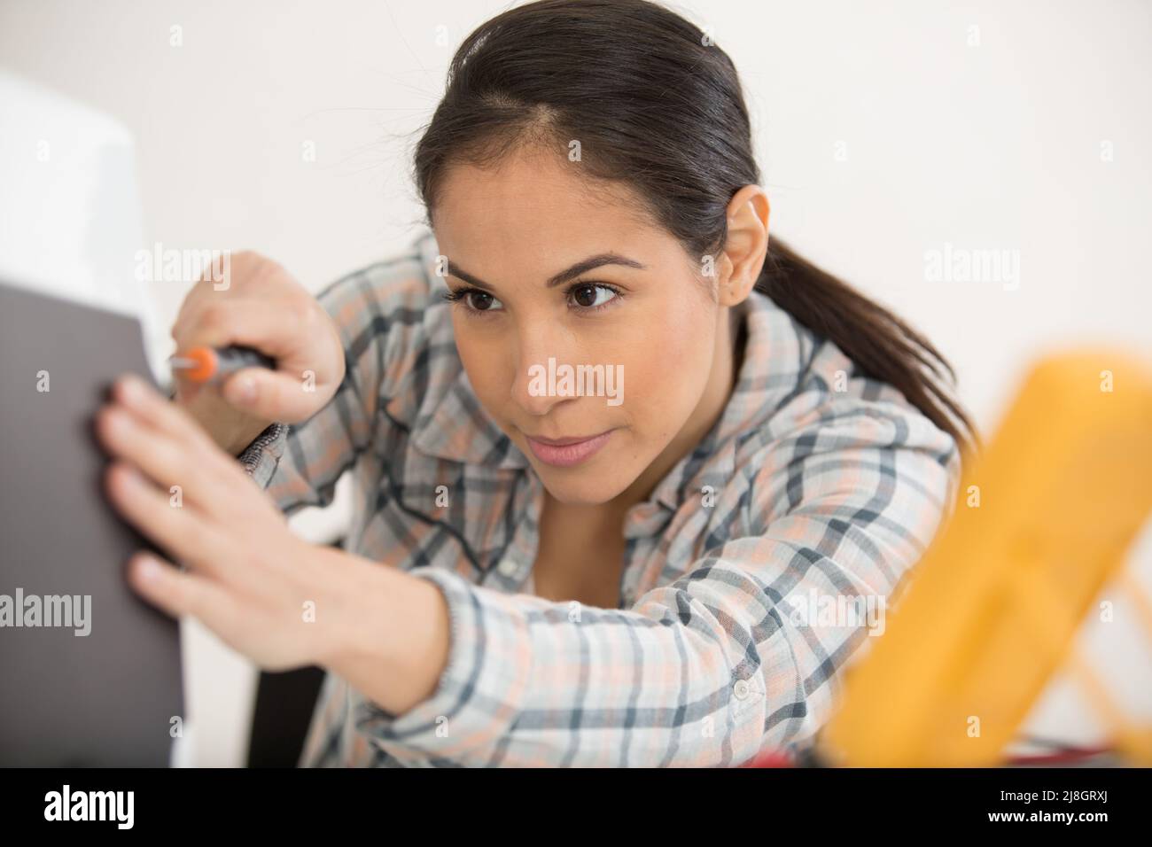 young attractive female digital electronic engineer testing computer pc ...