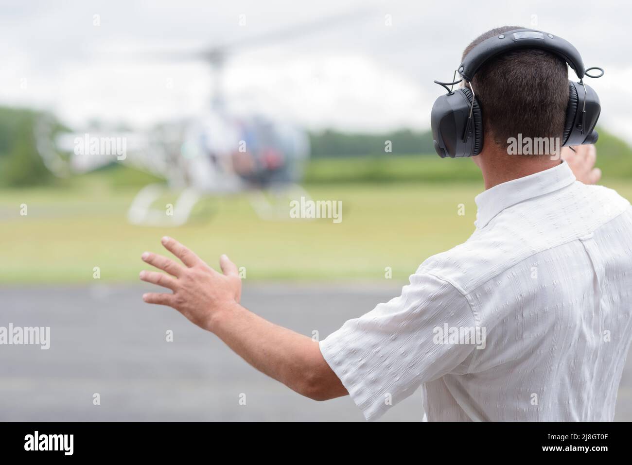 a man controls a helicopter Stock Photo - Alamy