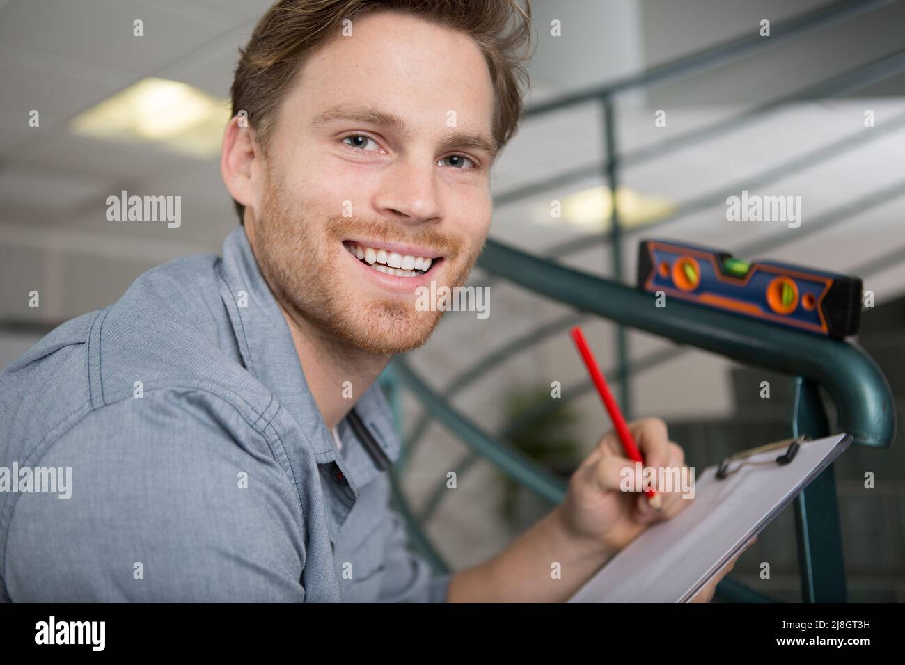a smiling worker at work Stock Photo - Alamy