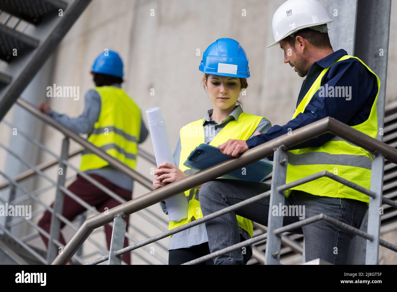 workers at a metal staircase Stock Photo - Alamy