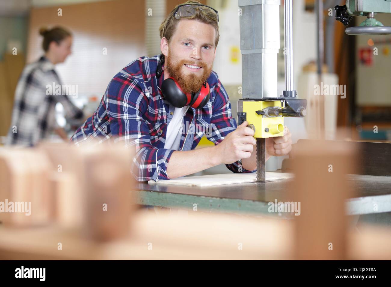 young happy carpenter at work Stock Photo - Alamy