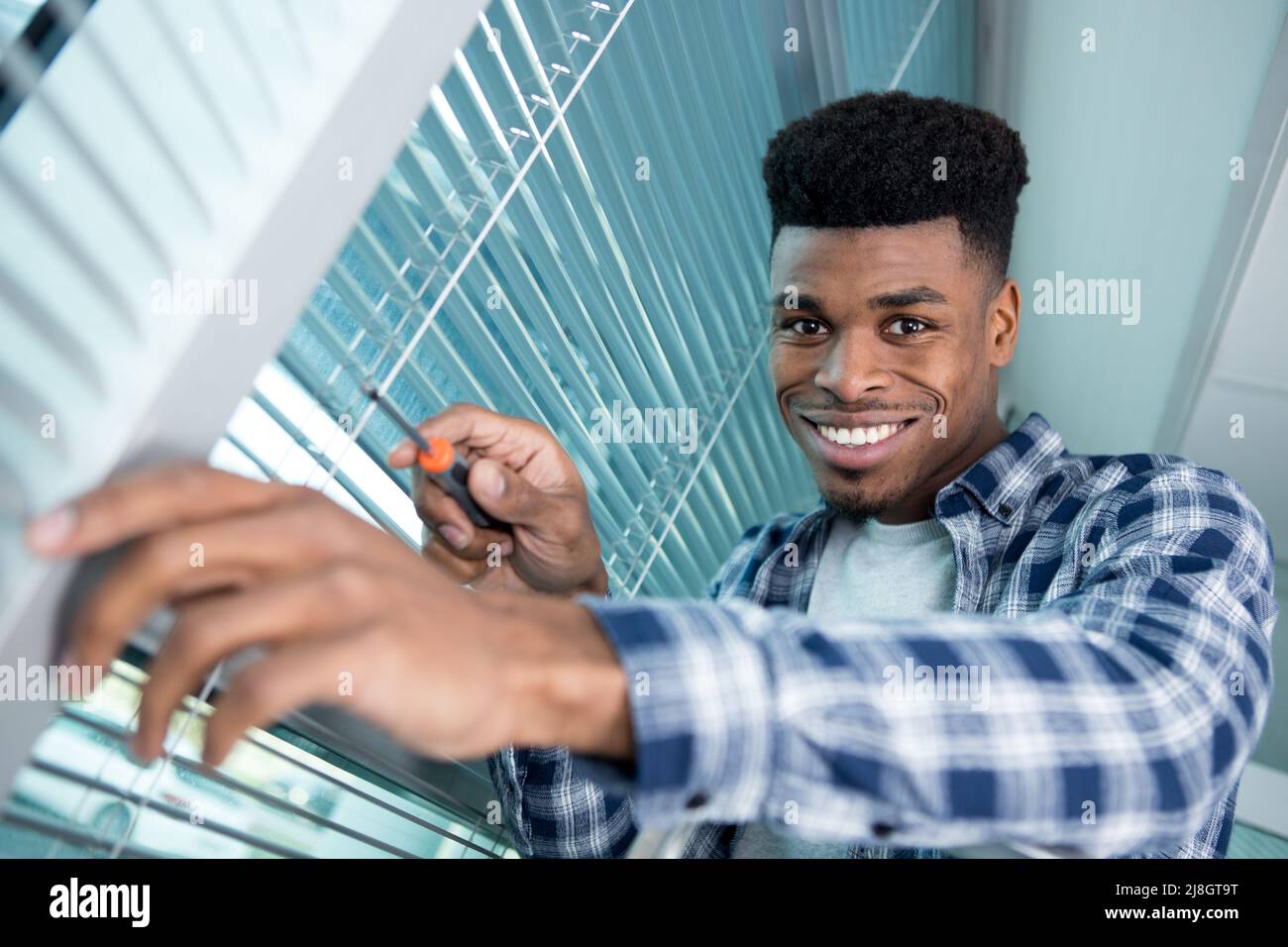 Installing window blinds hi-res stock photography and images - Alamy