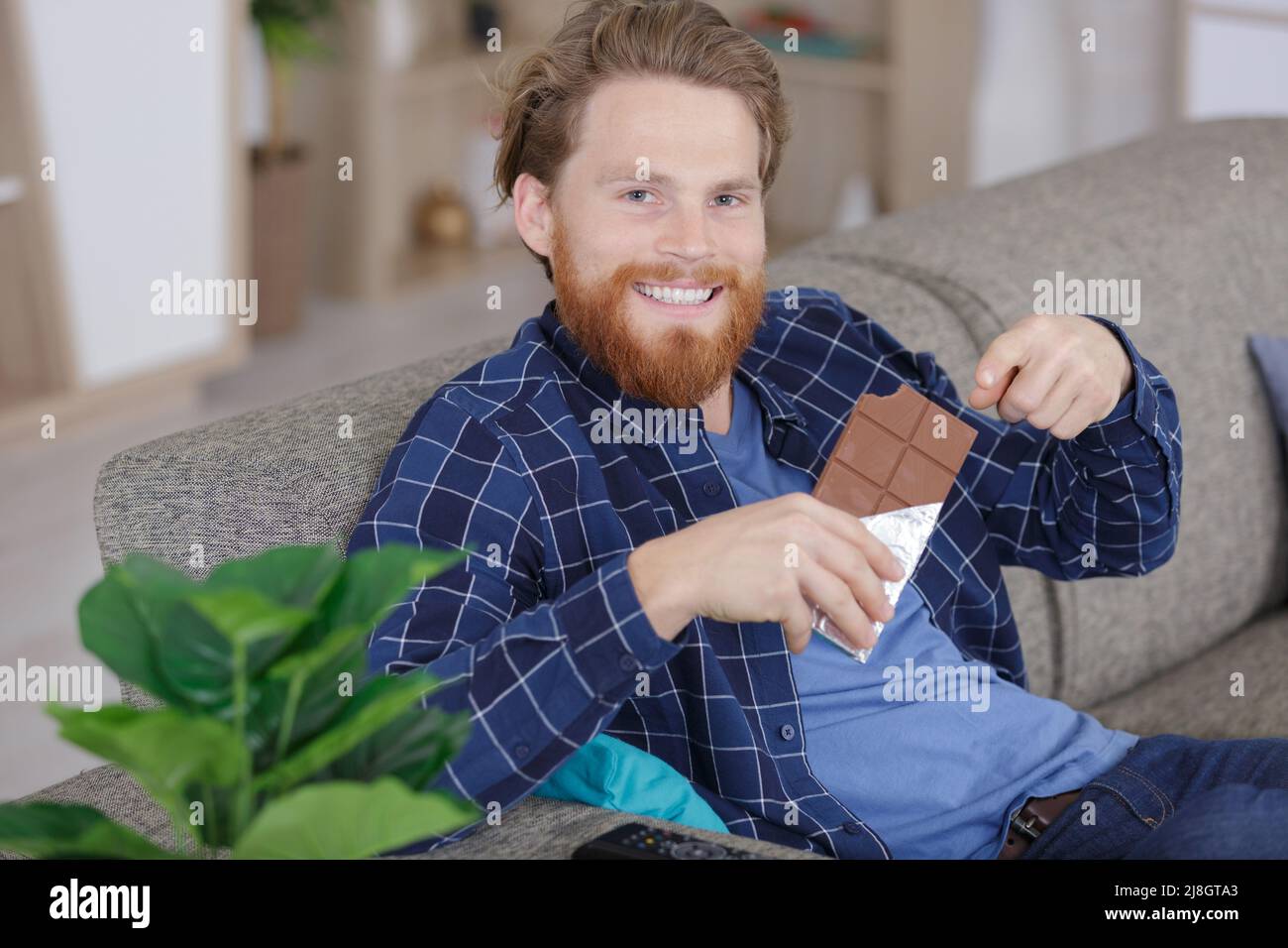 Man eating chocolate hi-res stock photography and images - Alamy