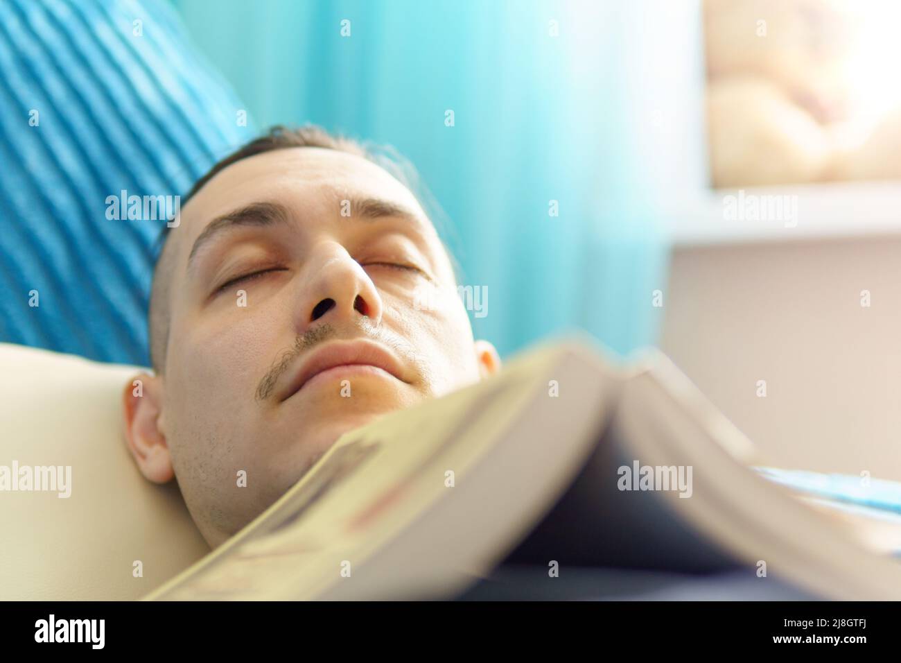 Man book sleeping on sofa hi-res stock photography and images - Alamy