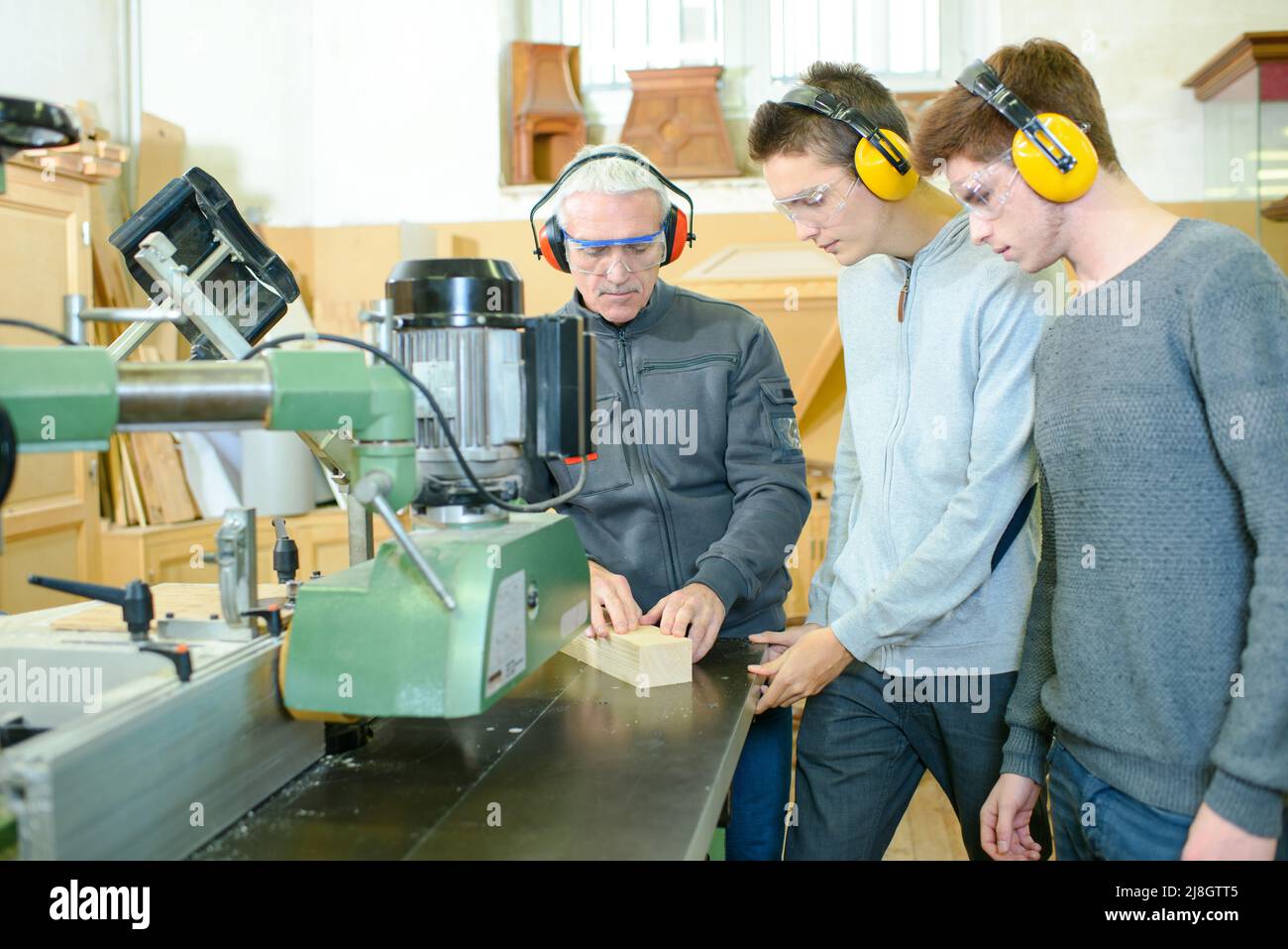senior and young men - woodwork apprenticeship Stock Photo - Alamy