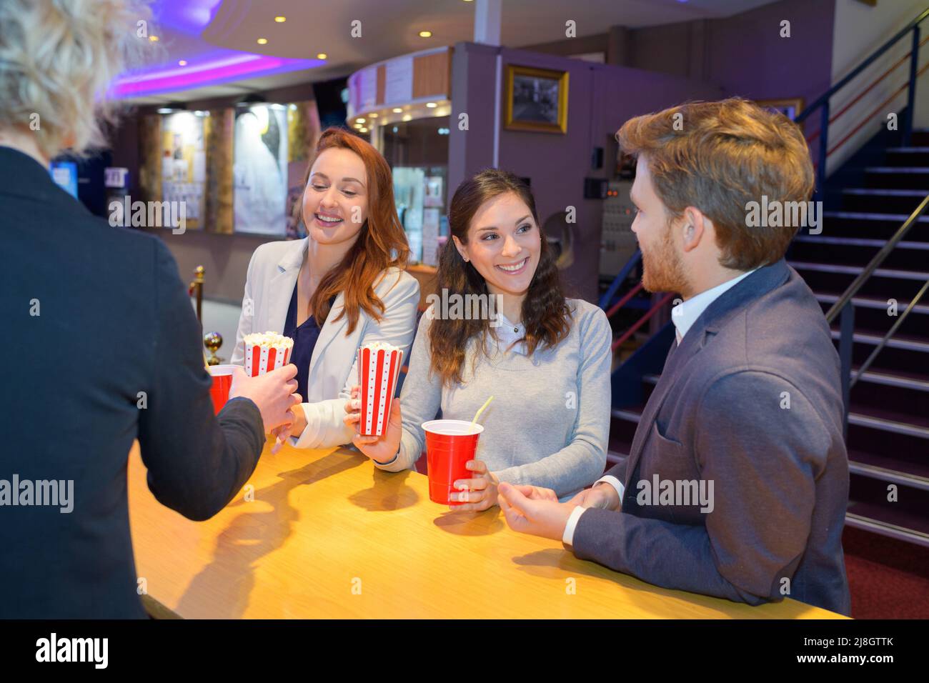 having a drink at cinema counter Stock Photo - Alamy