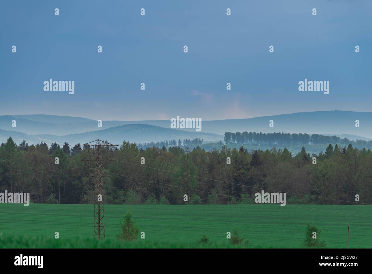 Vast, undulating terrain covered with arable fields, meadows and ...