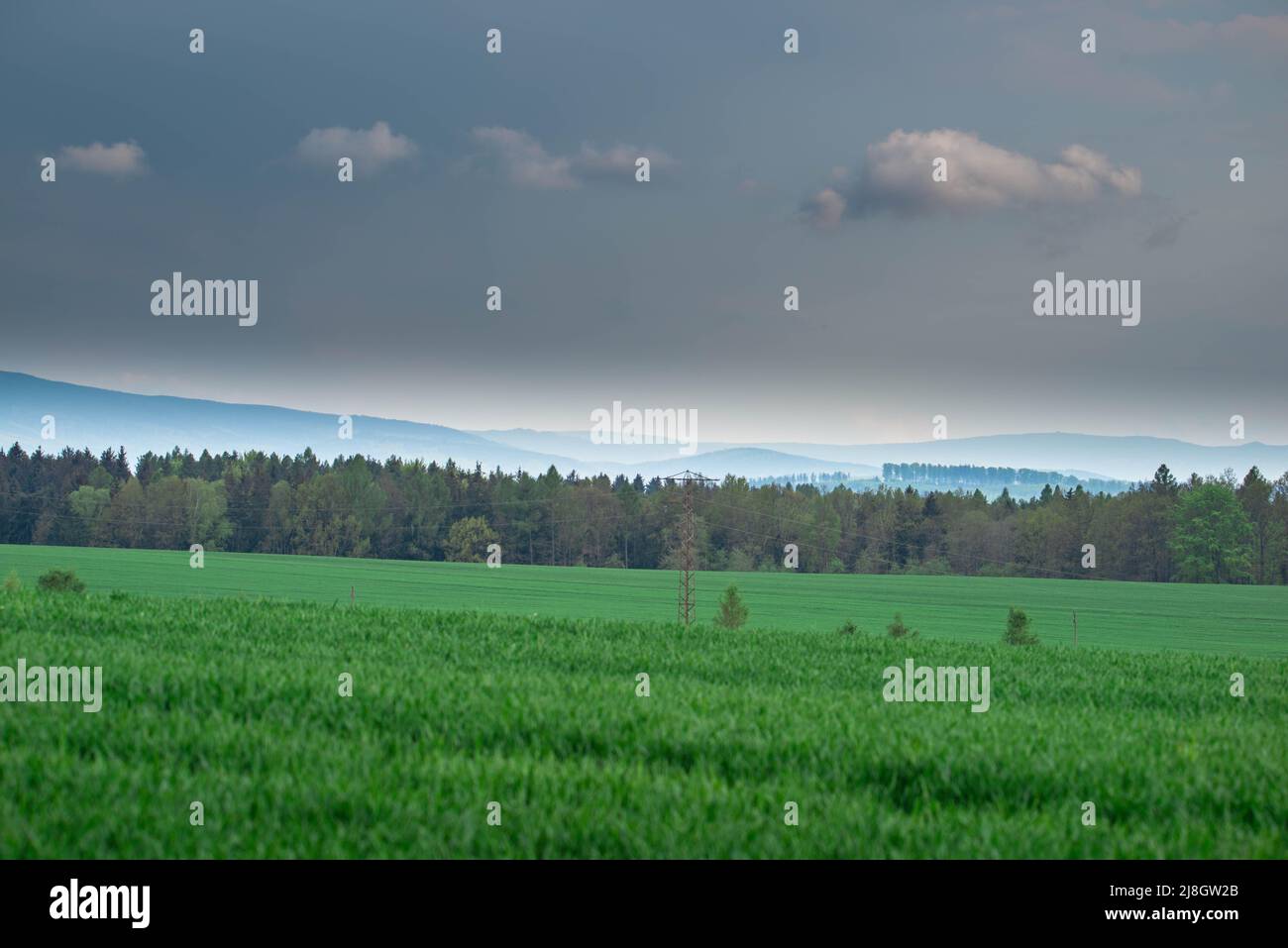 Vast, undulating terrain covered with arable fields, meadows and ...