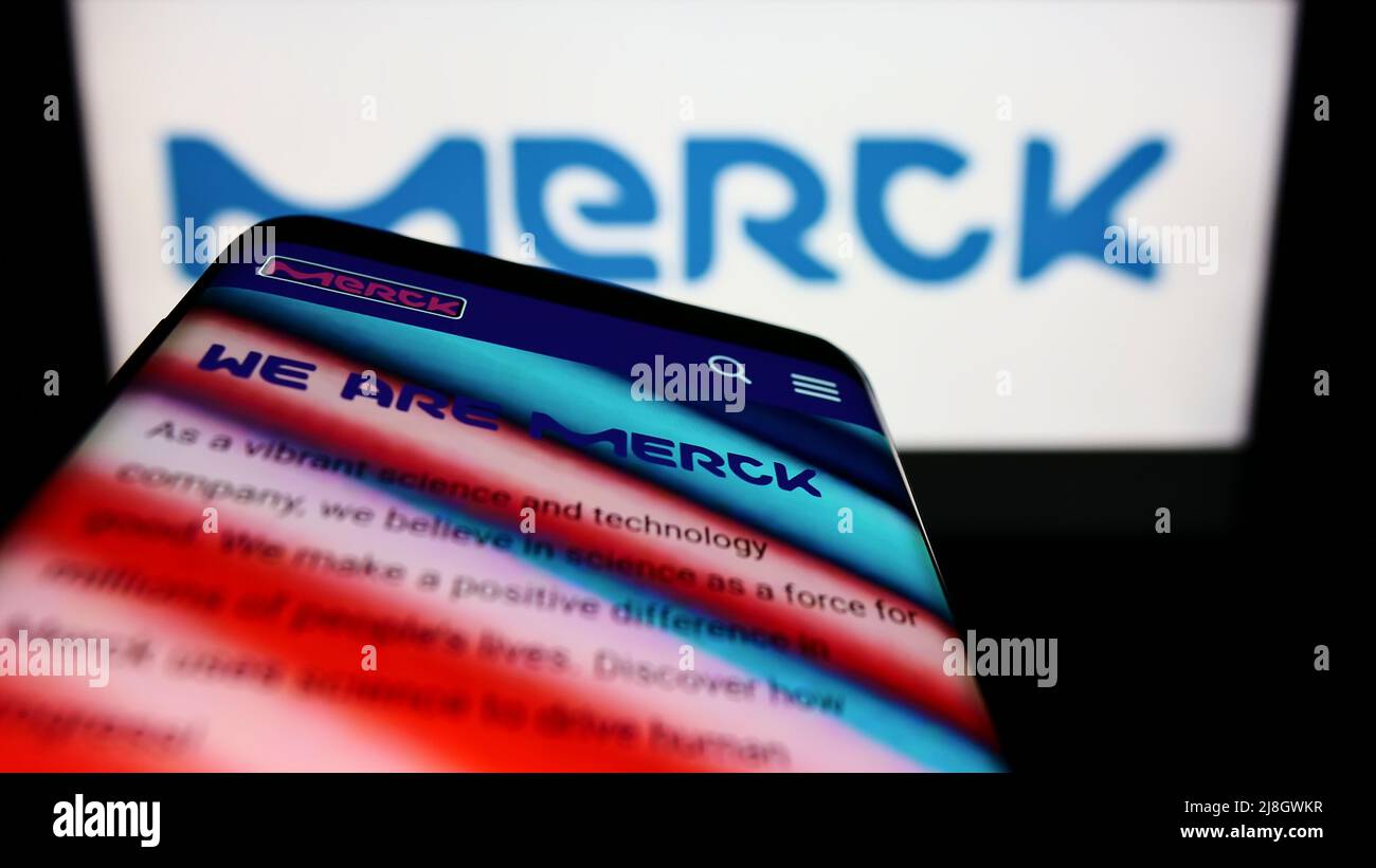 Mobile phone with website of German chemicals company Merck KGaA on ...