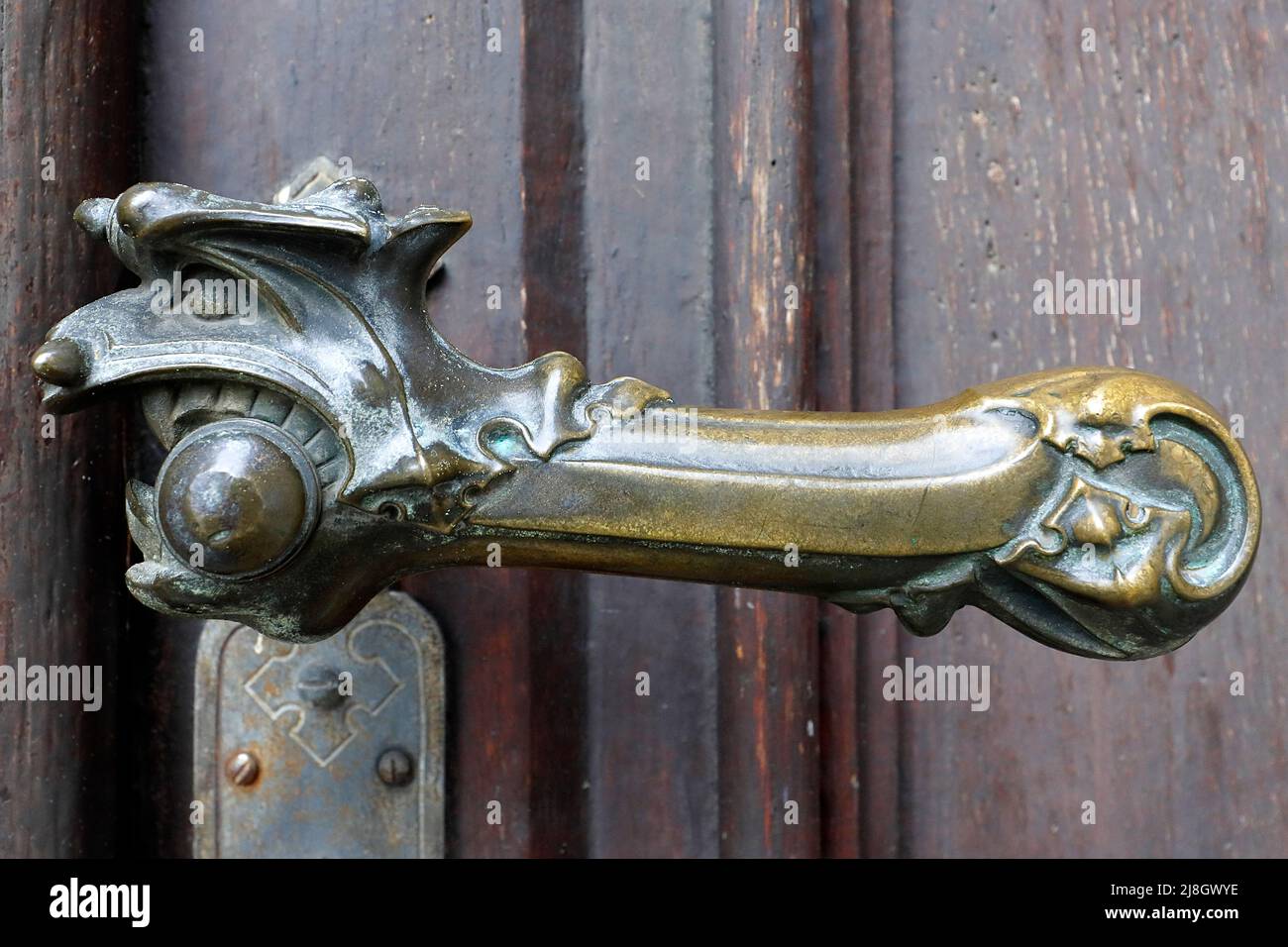 An old door handle depicting a mythical creature Stock Photo - Alamy