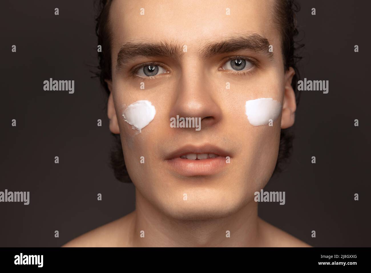Facial skin care for man. Young happy man with perfect well-kept skin ...