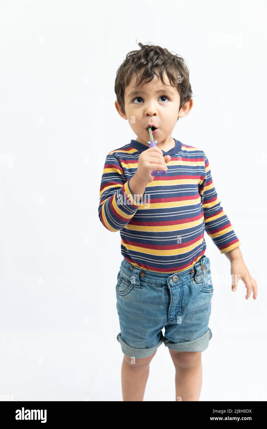 child brushing teeth on white background Stock Photo - Alamy