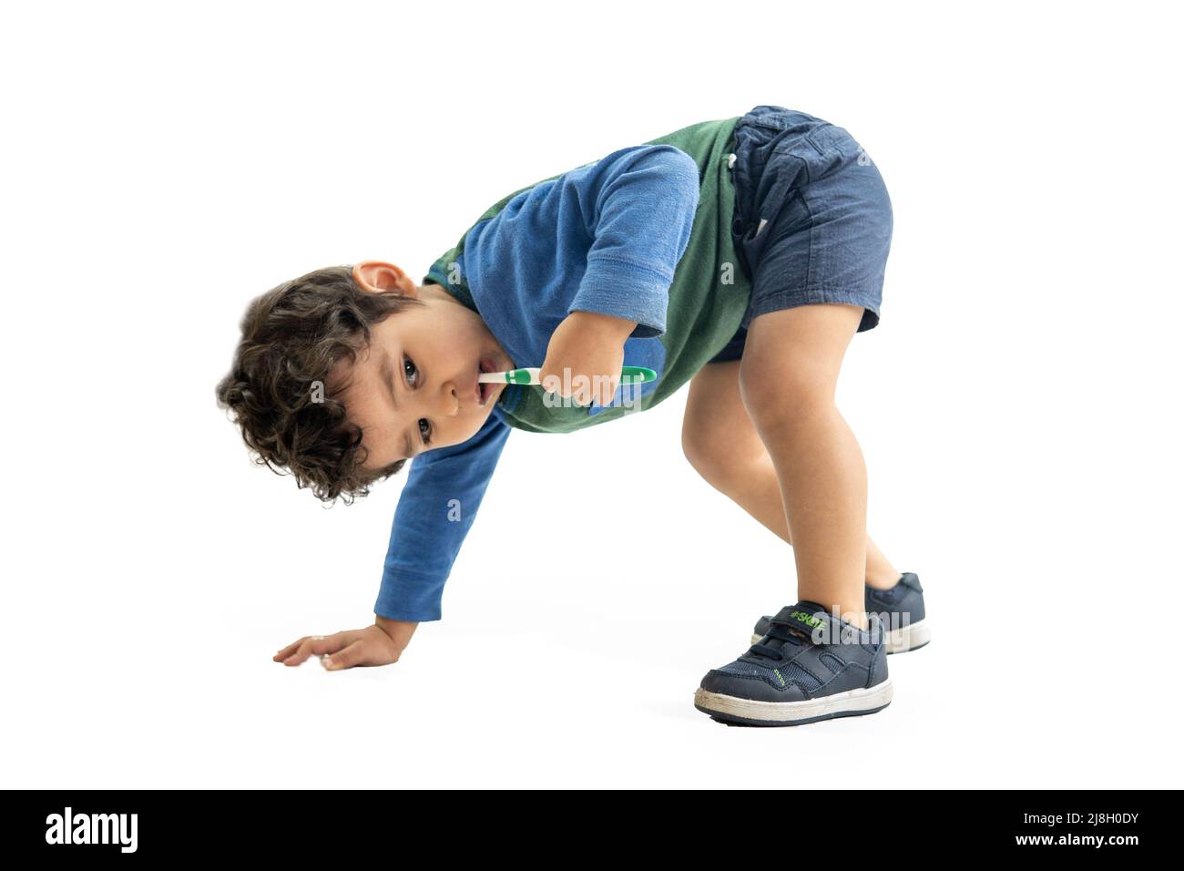 child brushing teeth and exercising on white background Stock Photo - Alamy