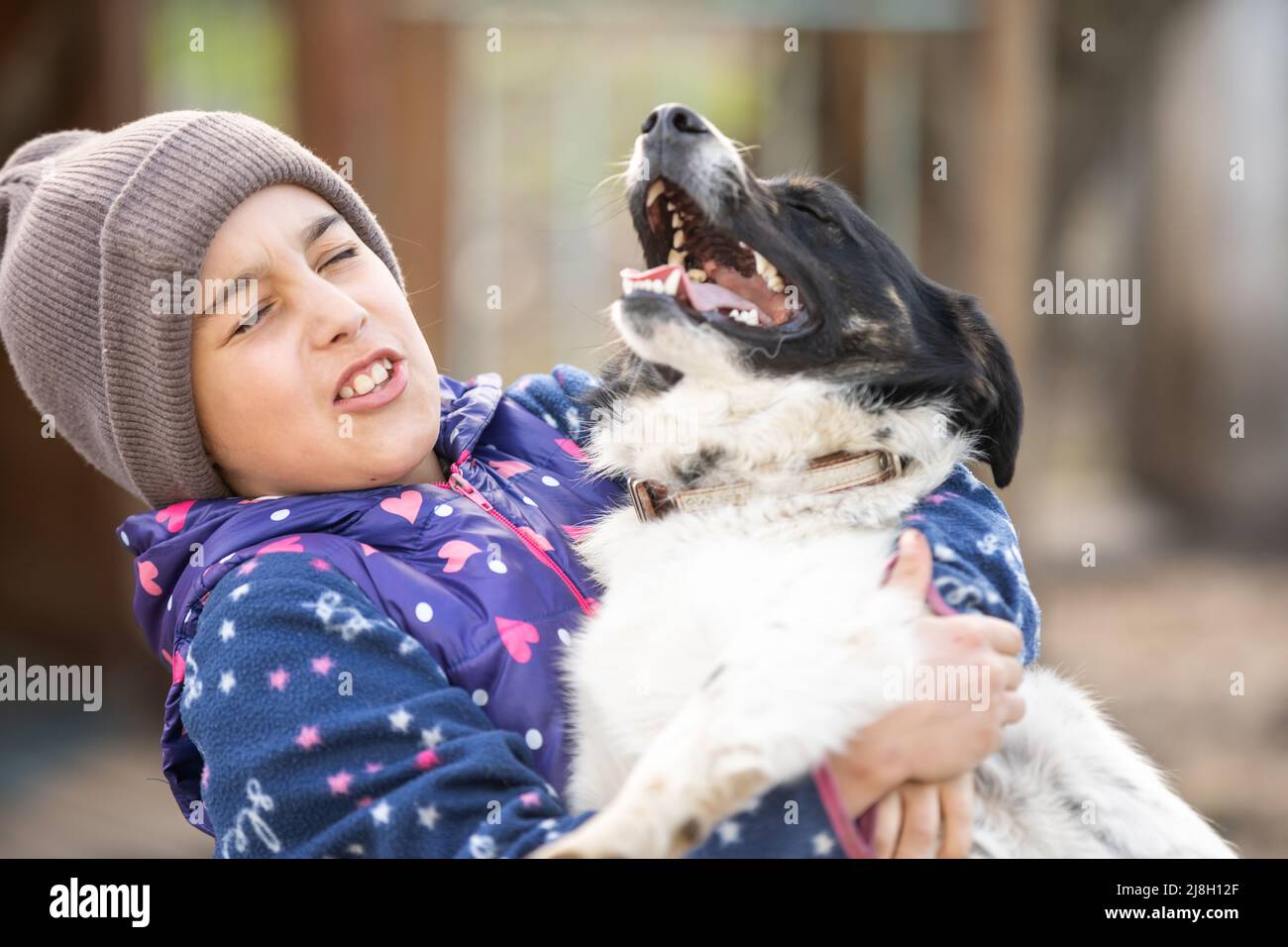 poor little girl with a dog in village Stock Photo - Alamy
