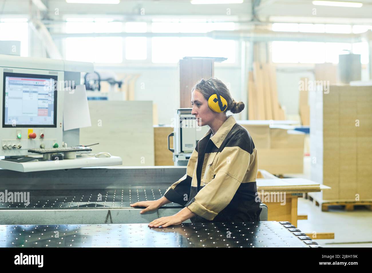 Female machine worker hi-res stock photography and images - Alamy