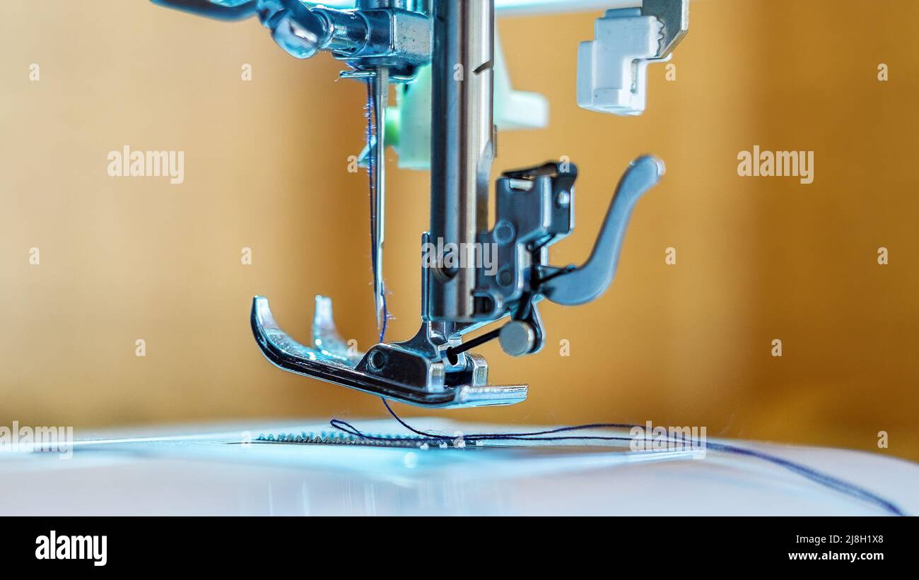 Sewing machine parts close-up - foot and needle Stock Photo - Alamy