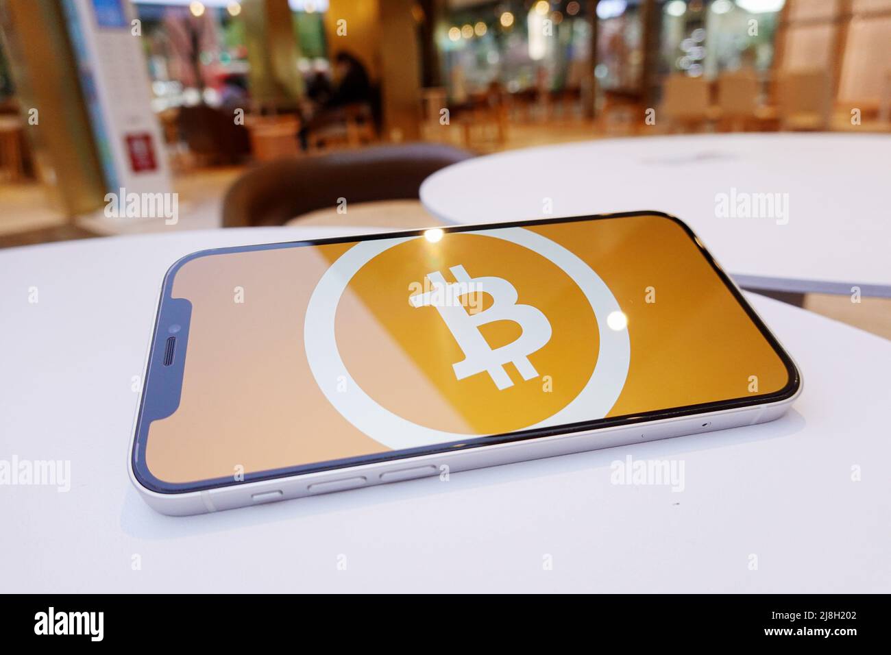 In this photo illustration, a Bitcoin logo is displayed on a smartphone ...