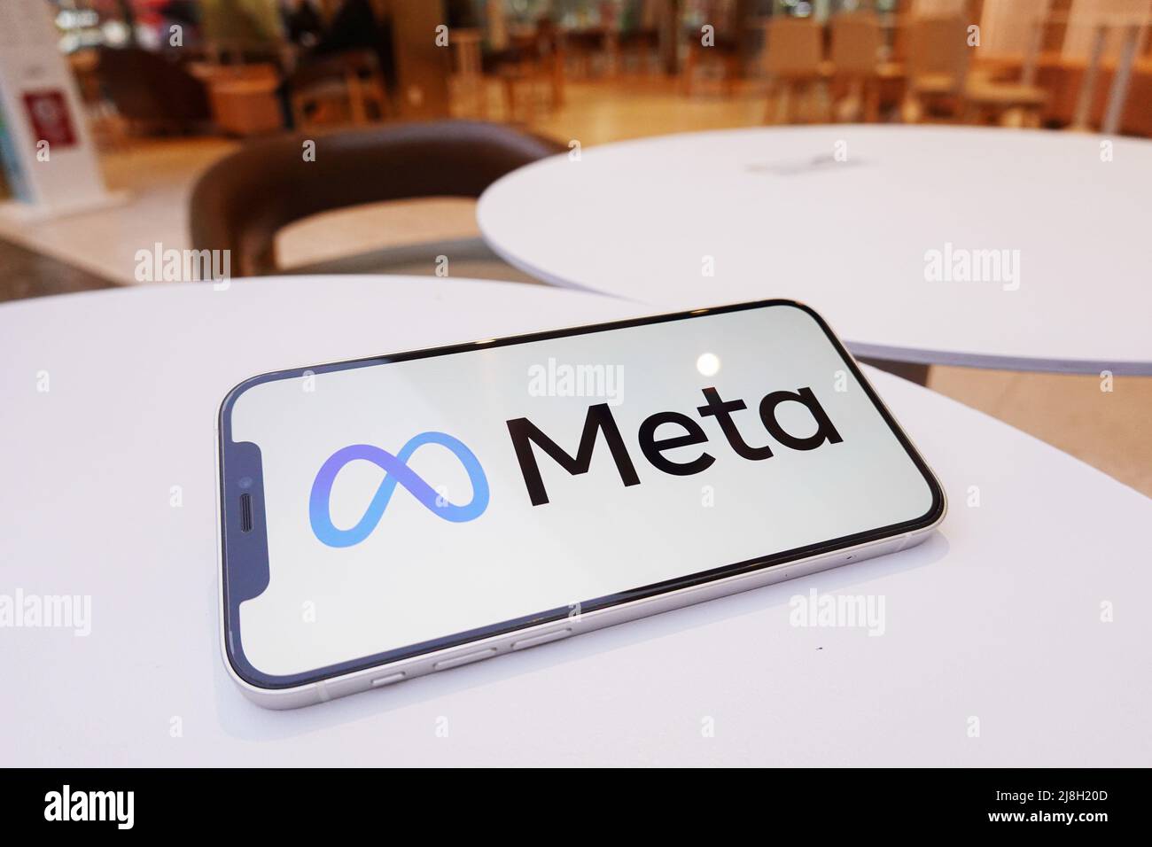 In this photo illustration, a Meta logo is displayed on the screen of a ...