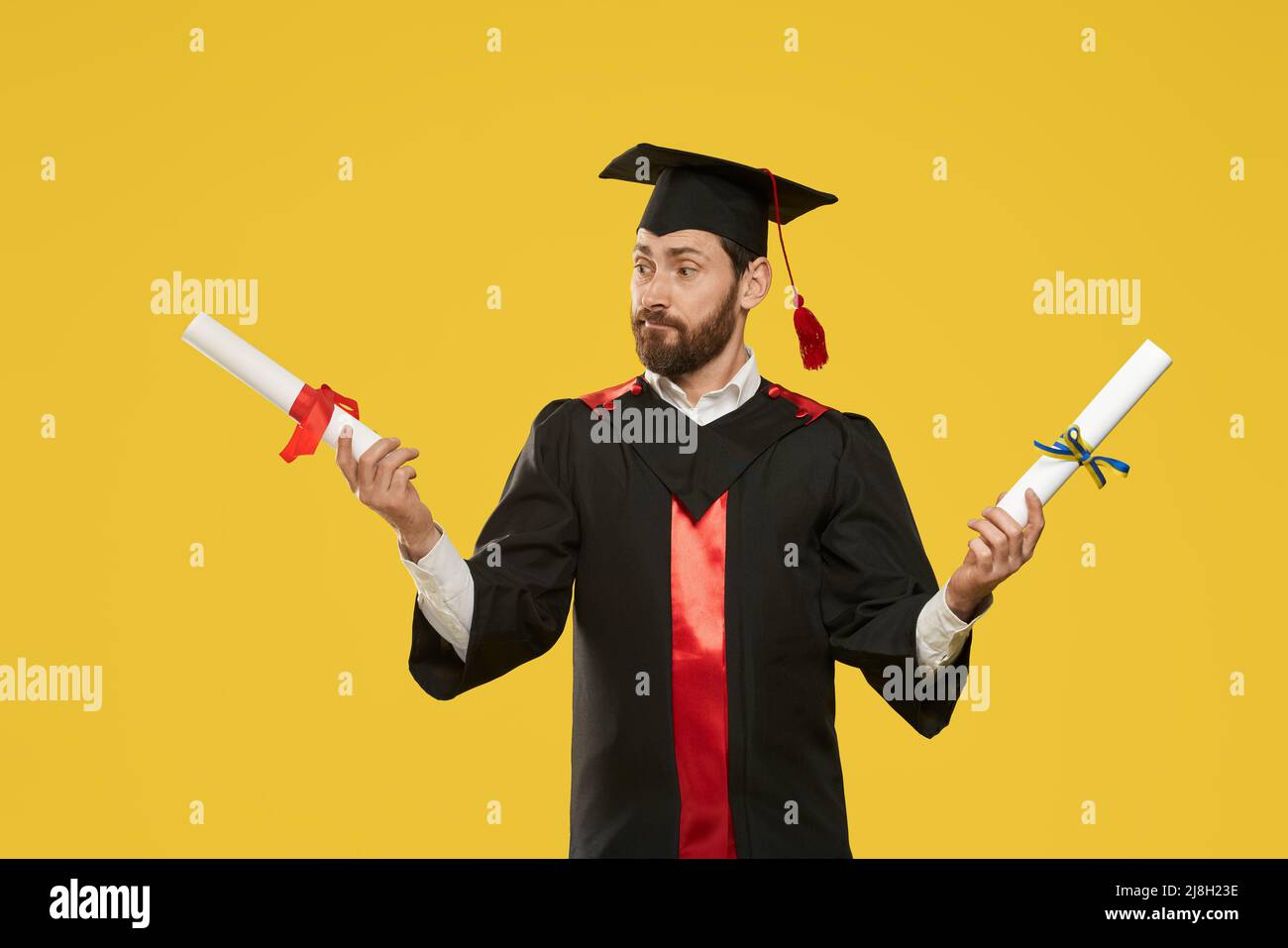 Front view of student with beard graduating from college, university ...