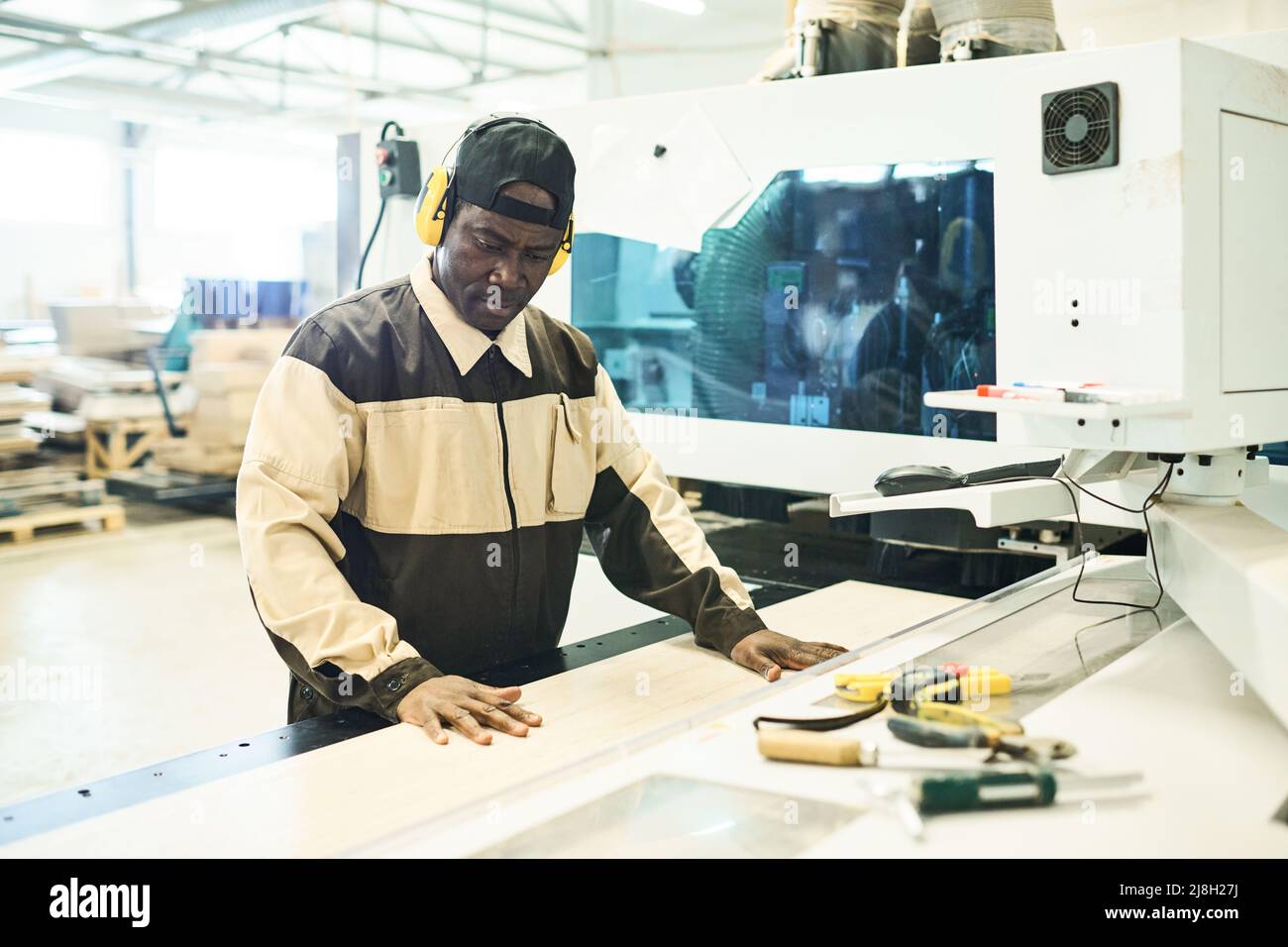 African carpenter cutting wooden hi-res stock photography and images ...
