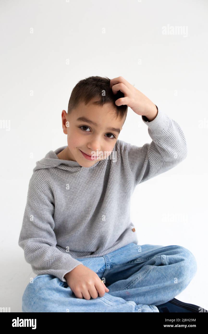 Boy child preschooler smiling and posing on gray background in photo ...