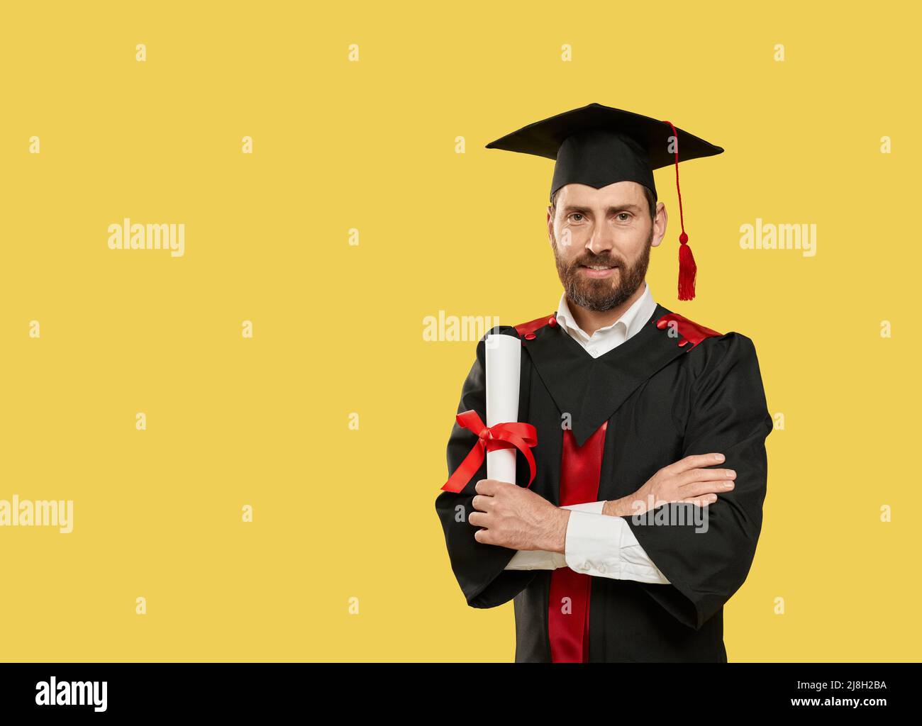 Front view of handsome male with beard graduating from unversity ...