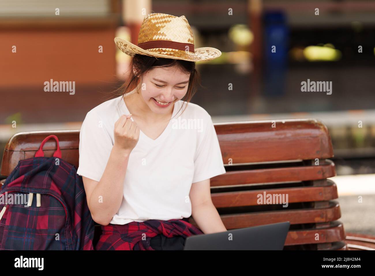 Image of Young freelance working at train station before travel. work ...