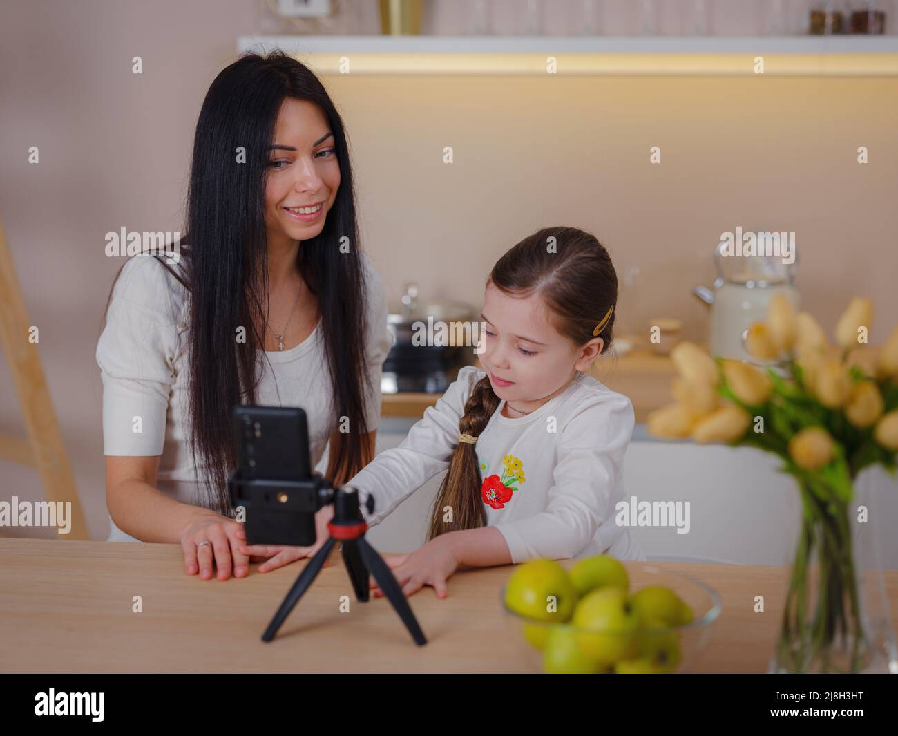 Blogger mom with her baby at home. Millennial Influencer woman creating ...