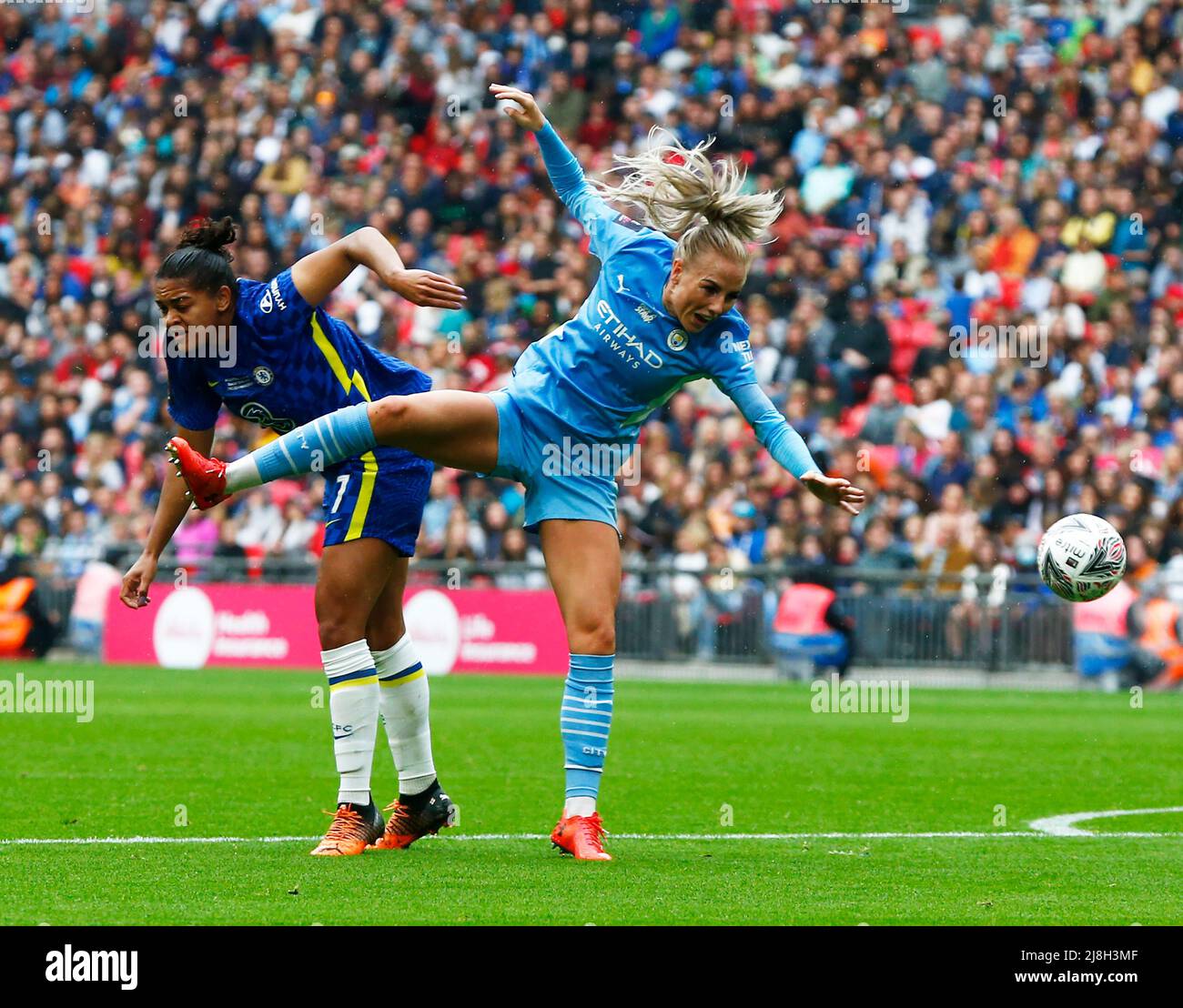 LONDON, ENGLAND - MAY 15:L-R Manchester City Fansand Alex Greenwood of ...