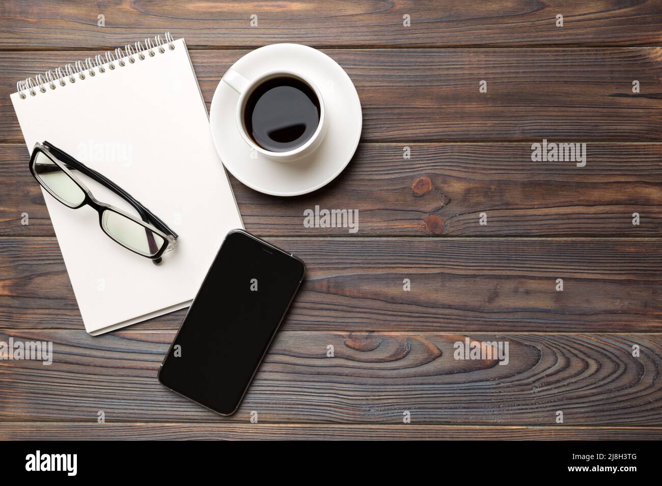 Modern office desk table with notebook, smartphone and other supplies ...