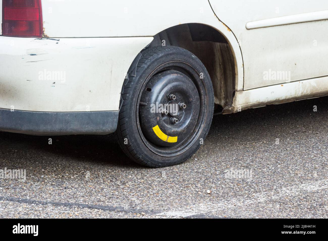 Emergency spare wheel on car, Hungary Stock Photo - Alamy