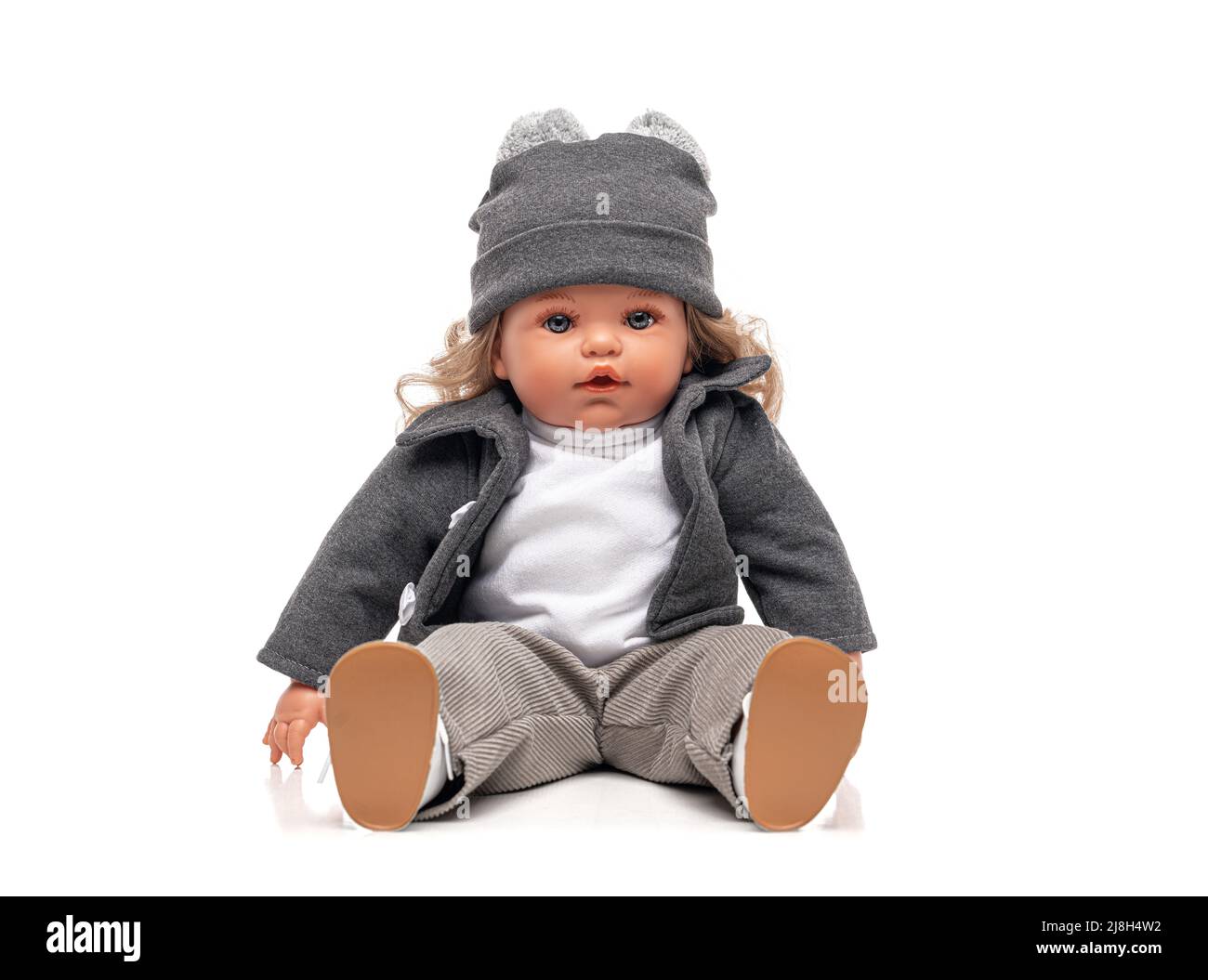 Little plastic doll baby girl isolated on white Stock Photo - Alamy