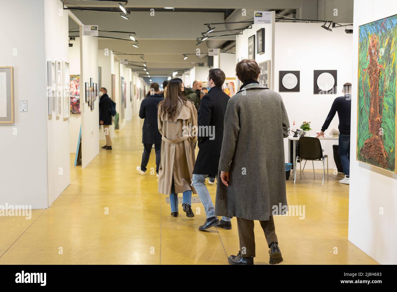 People Walking and Admiring Paintings in a Modern Art Gallery Stock ...