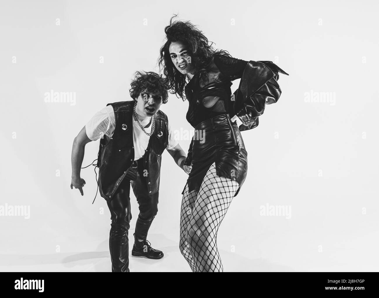 Wide angle view. Monochrome portrait of crazy musicians, young boy and ...