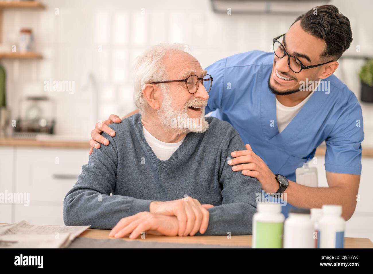 Caring healthcare worker embracing an elderly person Stock Photo - Alamy