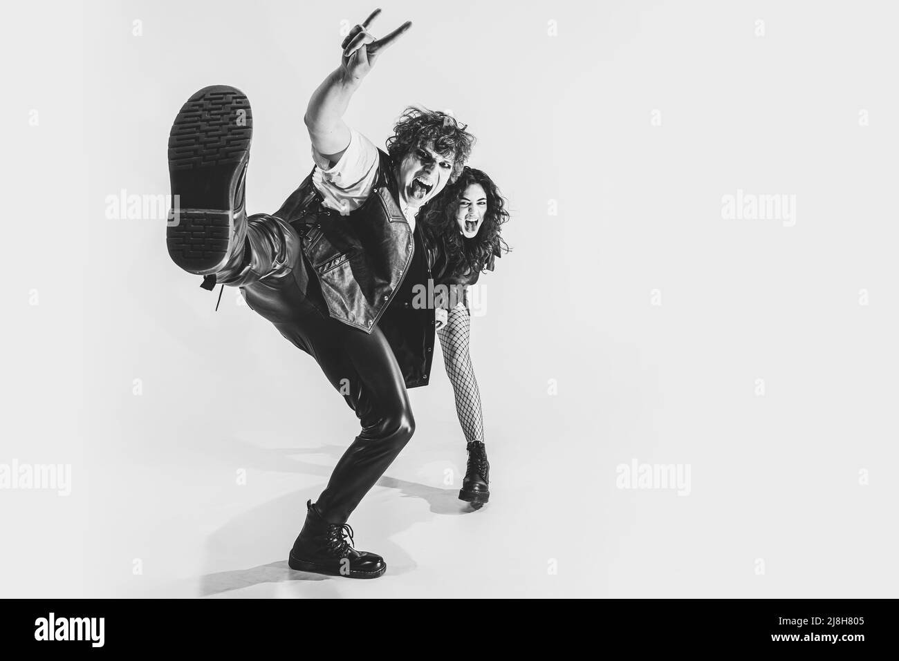 Wide angle view. Monochrome portrait of crazy musicians, young boy and ...