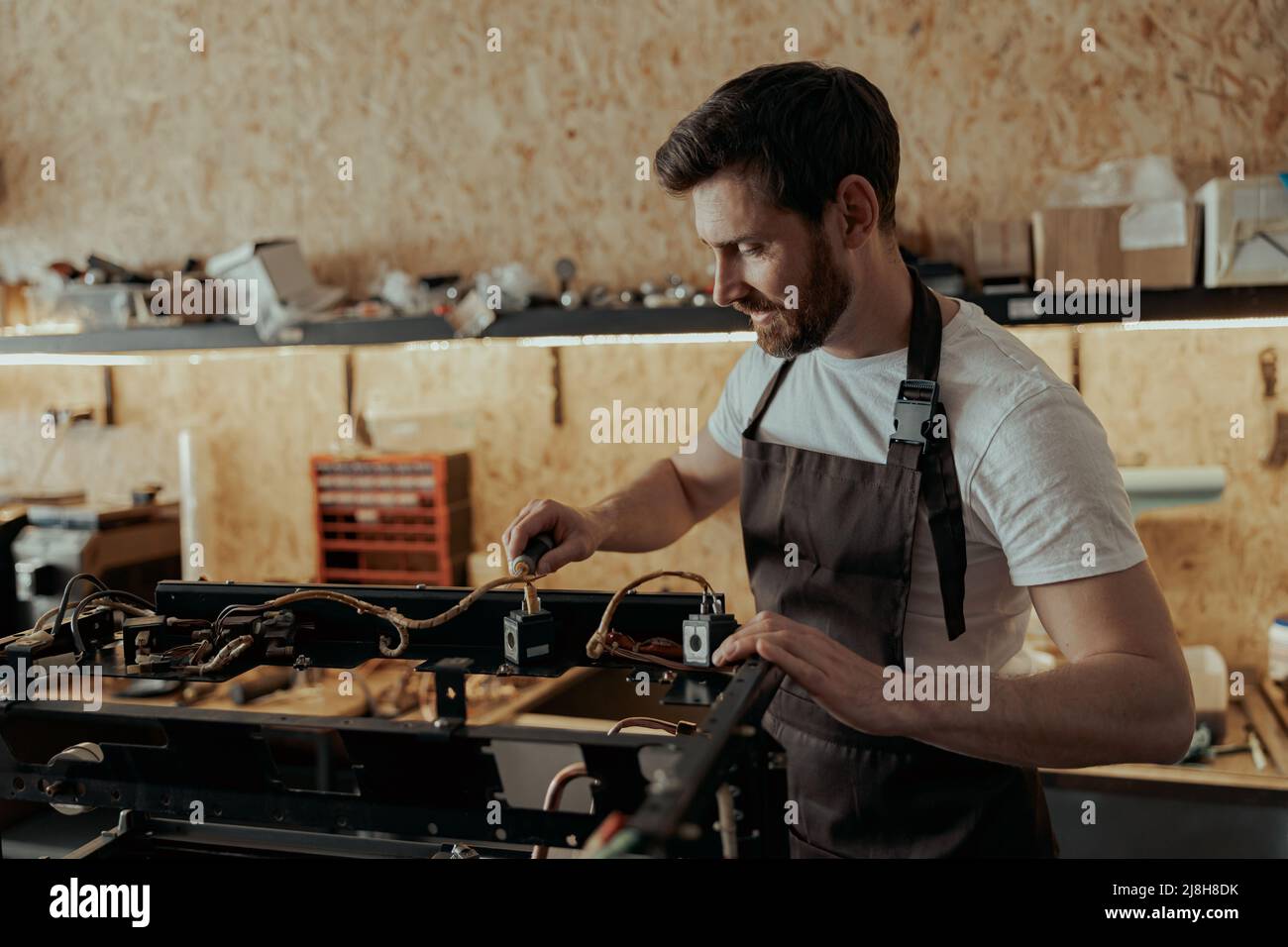Repairman fixing coffee machine hi-res stock photography and images - Alamy