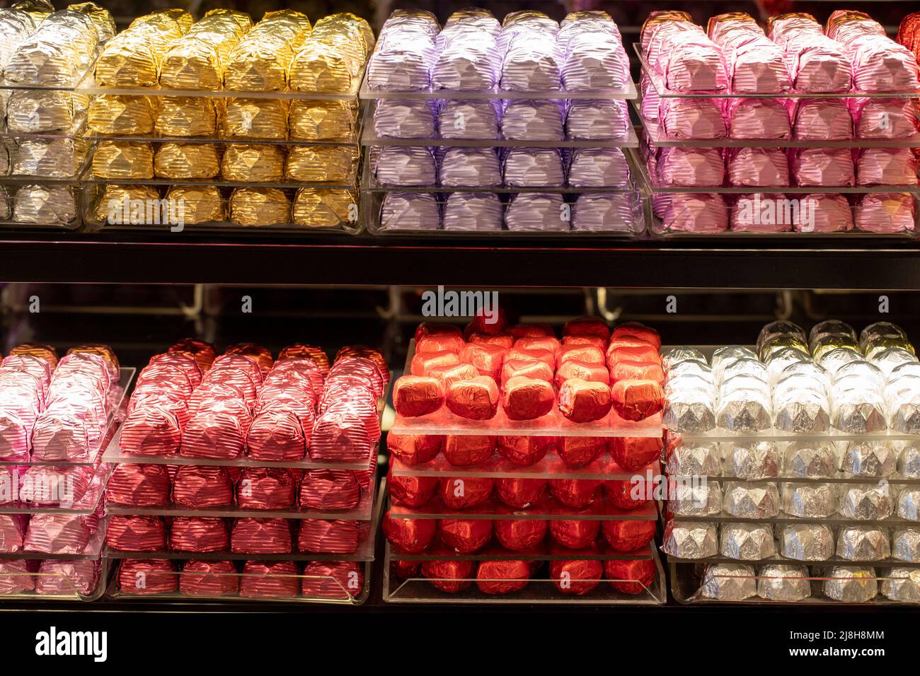 Chocolate stand. Patisserie chocolate counter. Specially coated ...