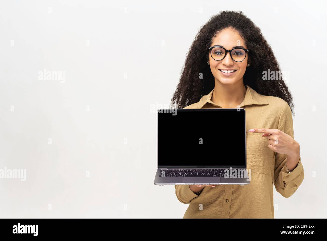 Satisfied multiracial woman advertising new computer app isolated on ...