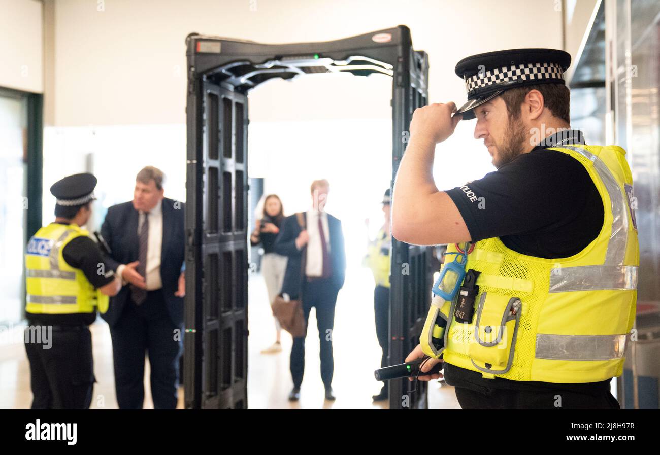 Police officers man a knife arch in a shopping centre in Peterborough ...
