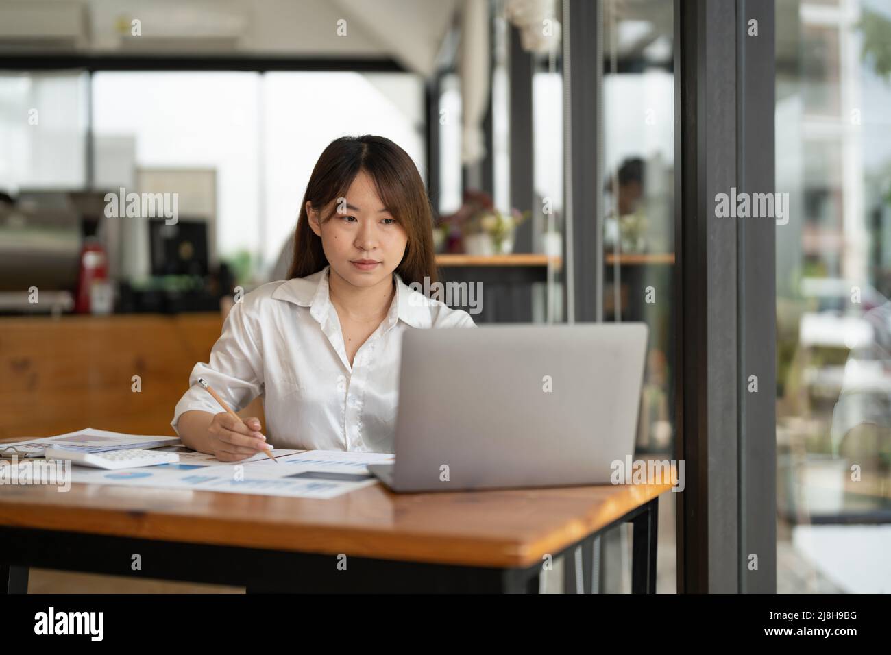 Accountant bookkeeping working with calculator for financial document ...