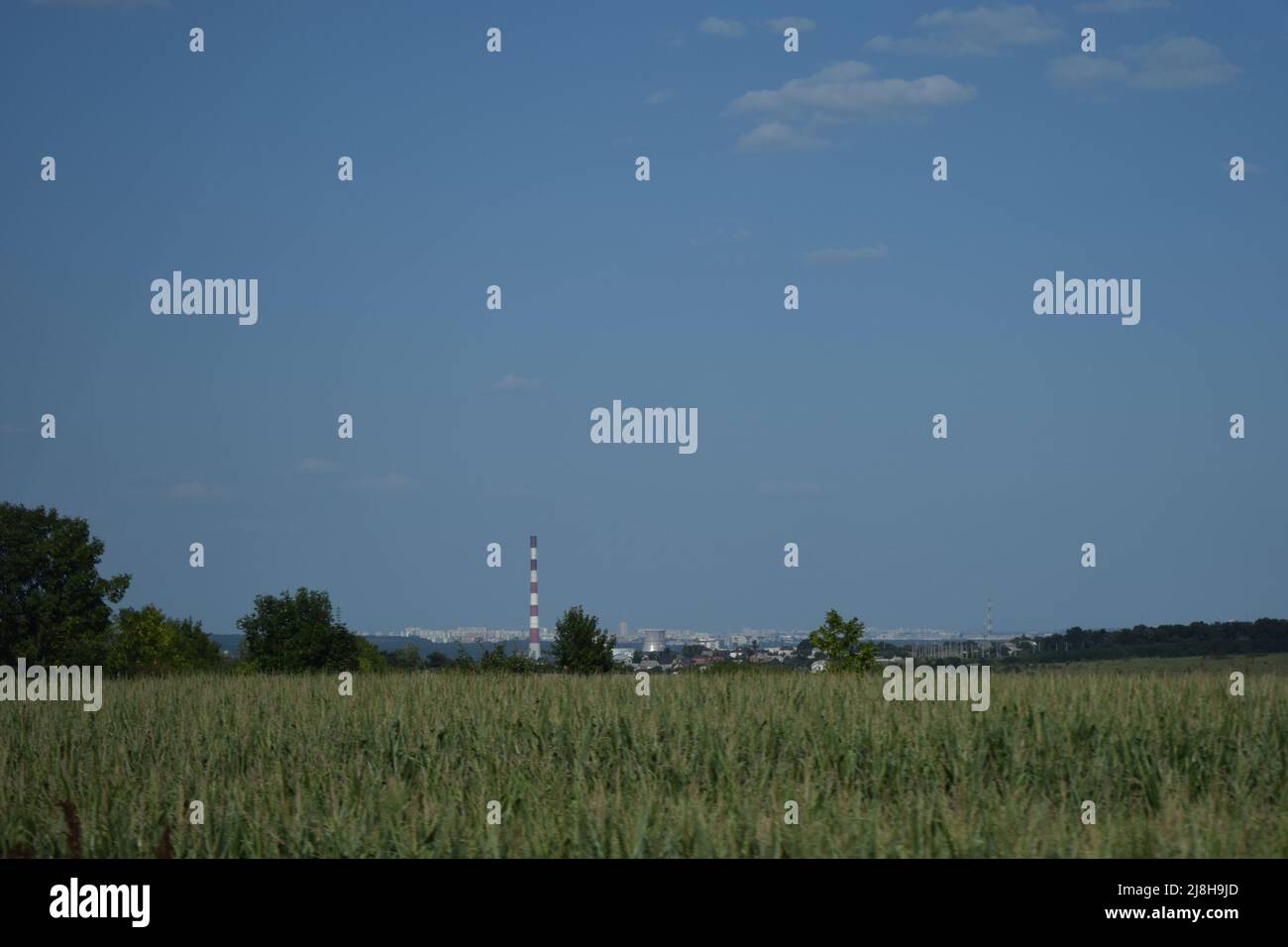 tower of industrial factory. Chimney smokestack emission. Refinery ...