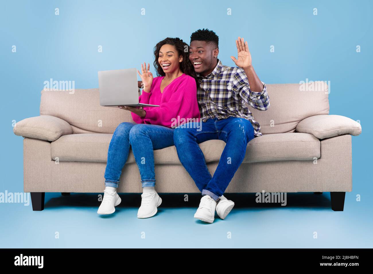 Black couple waving camera on hi-res stock photography and images - Alamy