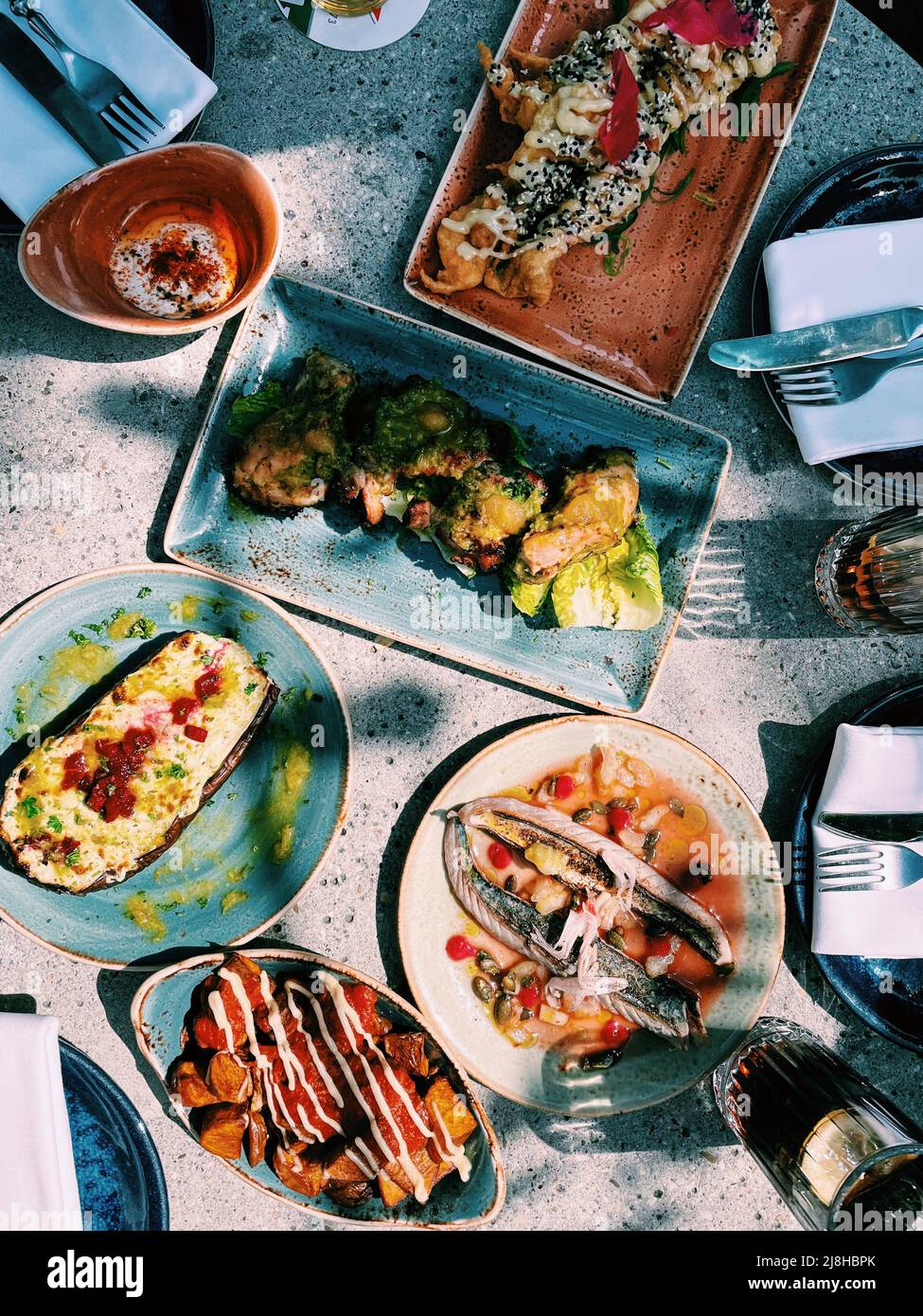 Topview of a table with tapas dishes. Mediterranean setting ...