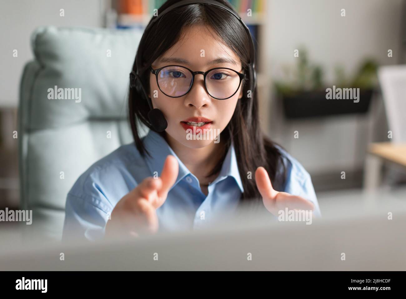 Woman wearing headset using hi-res stock photography and images - Alamy